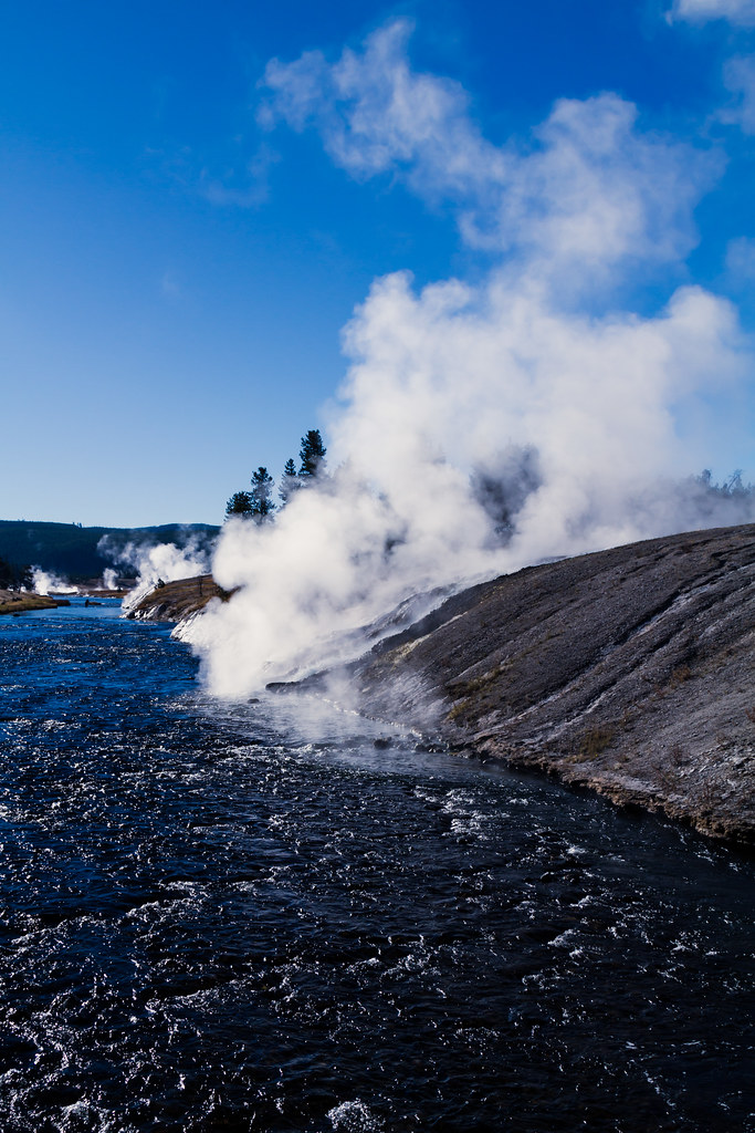Steam from Excelsior Geyser runoff along the Firehole River, Yellowstone National Park