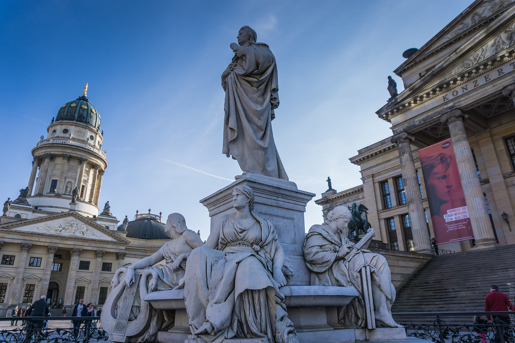 Friedrich Schiller Statue ensemble with allegorical figures in a neoclassical city square