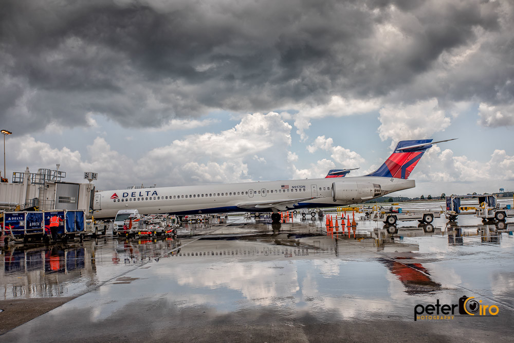 Reflections of Delta Airlines Aircraft Amidst a Dramatic Stormy Sky in Atlanta