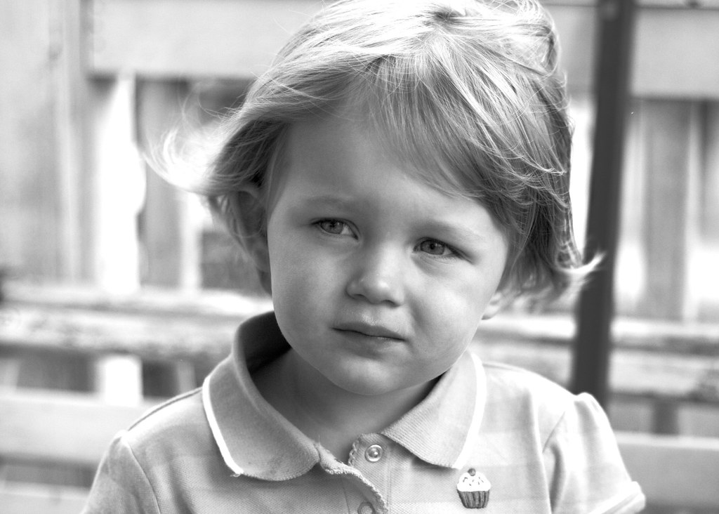 Memorial Day Weekend 2009: Wind-swept close-up portrait of a young child in a polo shirt