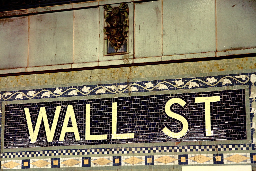 WALL ST Mosaic Tile Sign on a Weathered Tile Wall