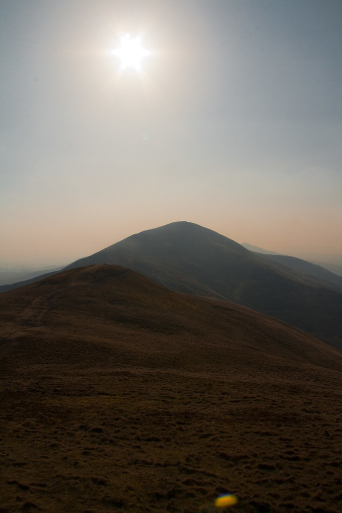 Ridge Line Toward a Dome-Shaped Peak under a Bright Midday Sun