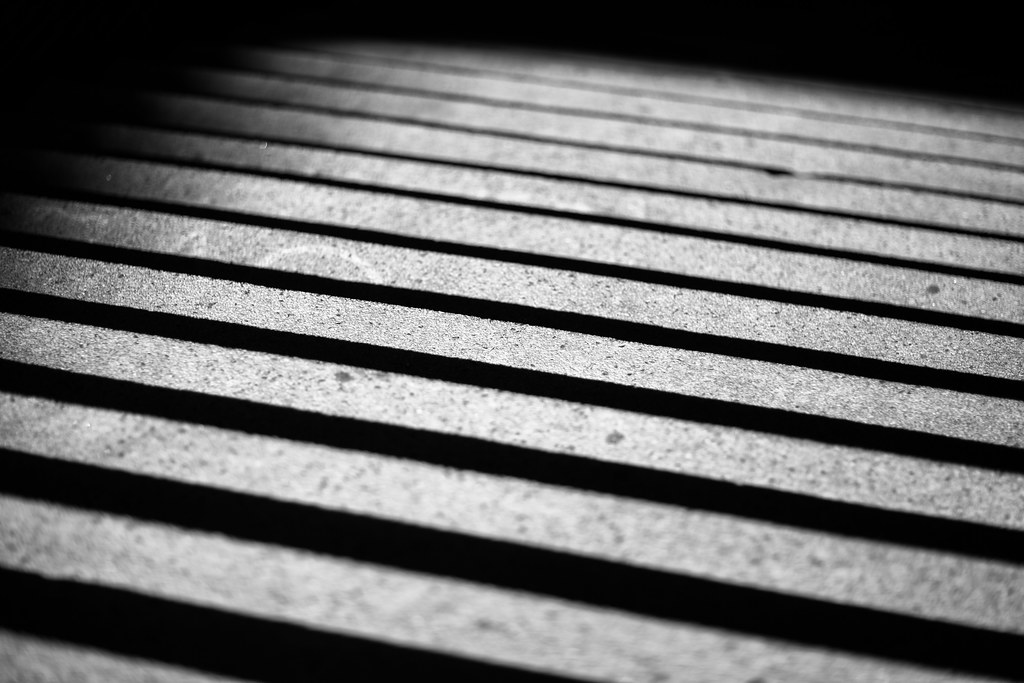 Diagonal Ridges in Monochrome: Close-Up of Textured Concrete Stripes