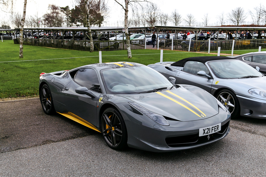 Ferrari 458 Italia in Gunmetal Gray with Yellow Racing Stripes at a Car Show