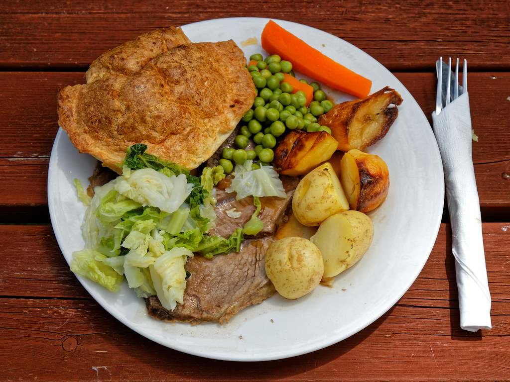 Roast beef dinner at The Queen's Head pub, Boreham, Essex: plate with sliced beef, roasted potatoes, peas, carrots and cabbage