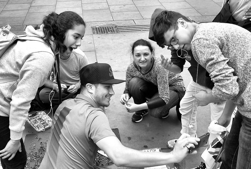 Circle of Friends on the City Sidewalk: a candid grayscale street moment