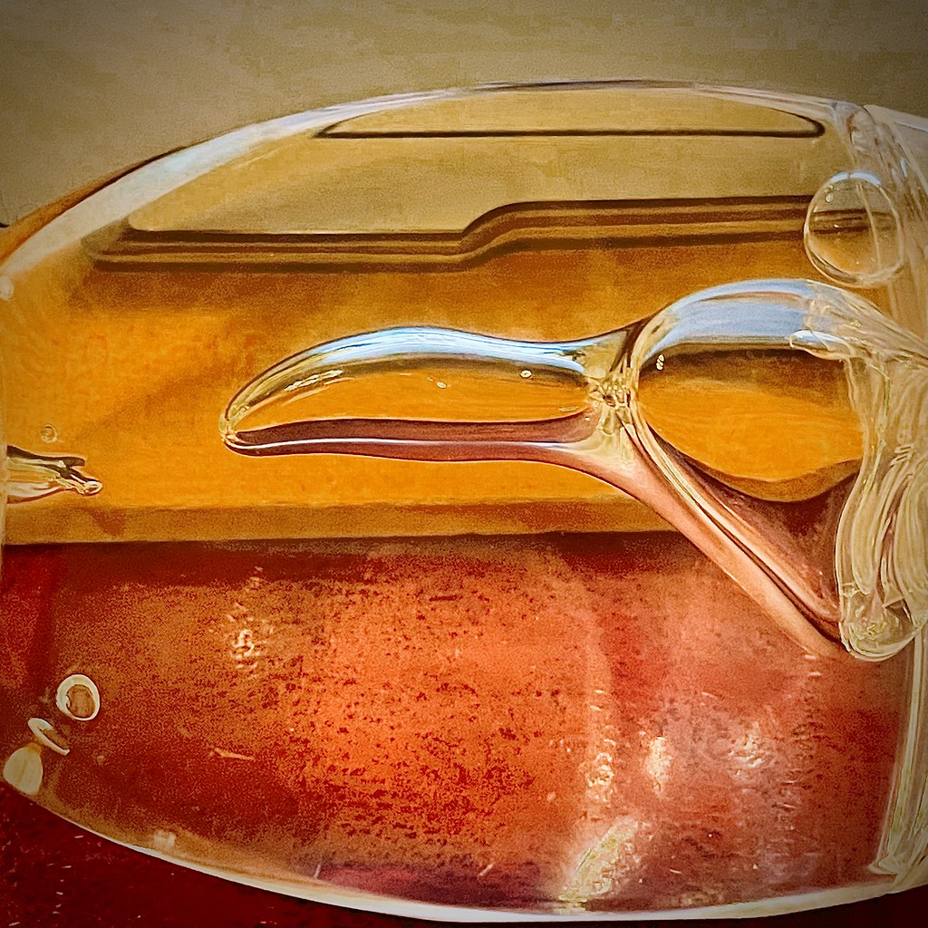 Amber Glass Bottle on Its Side: Close-Up Study of a Reused Hand Sanitizer Container