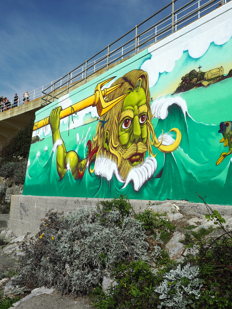 Plymouth Hoe Sea-Wall Mural: Green Sea God with Trident Amid Turquoise Waves