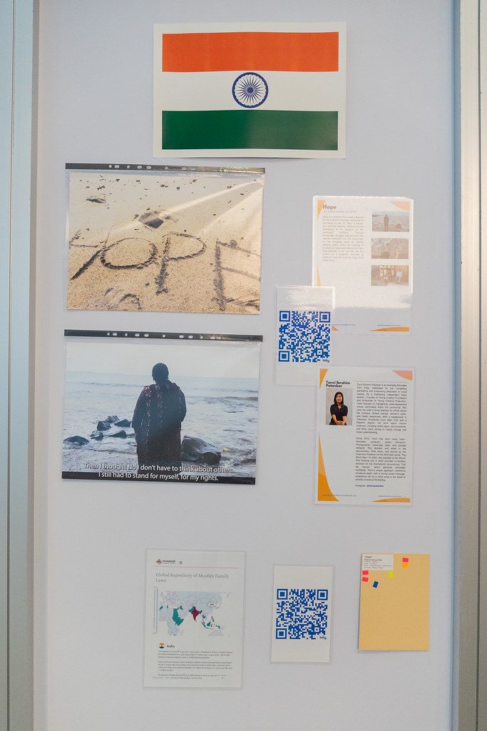 Exhibit Wall: Indian Flag, Sand Art Photo, Coastal Portrait, and QR Information Panels