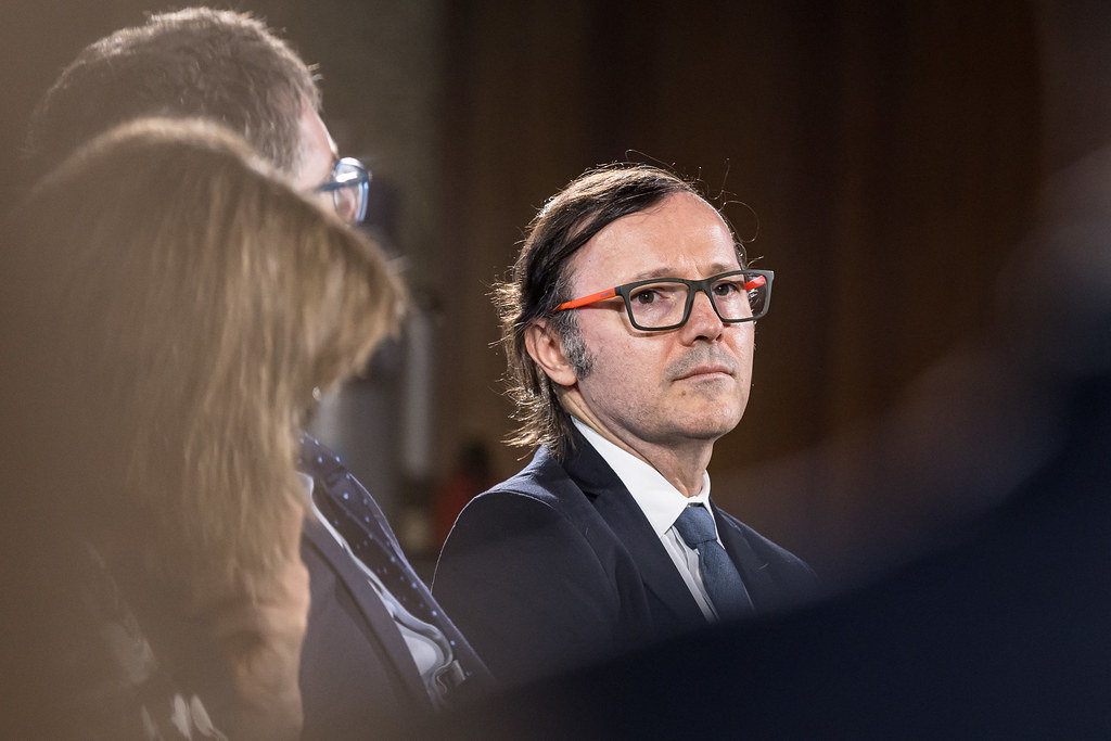Focused portrait of a conference attendee at the 2025 Global Platform for Disaster Risk Reduction in Geneva