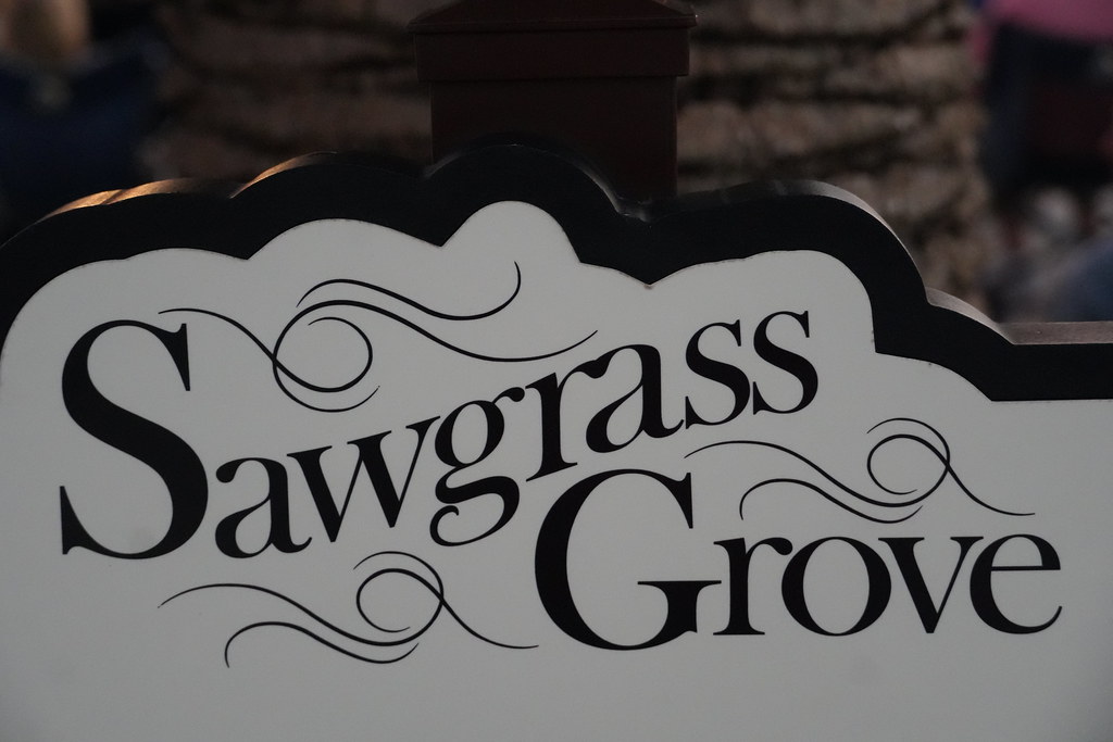 Sawgrass Grove: Decorative sign with ornate flourished script and scalloped top