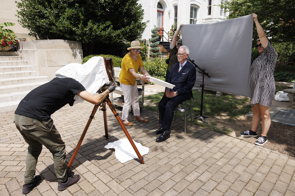 Daguerreotype-inspired outdoor portrait of a seated Librarian of Congress official, using a lens from the Robert Cornelius collection, July 23, 2025