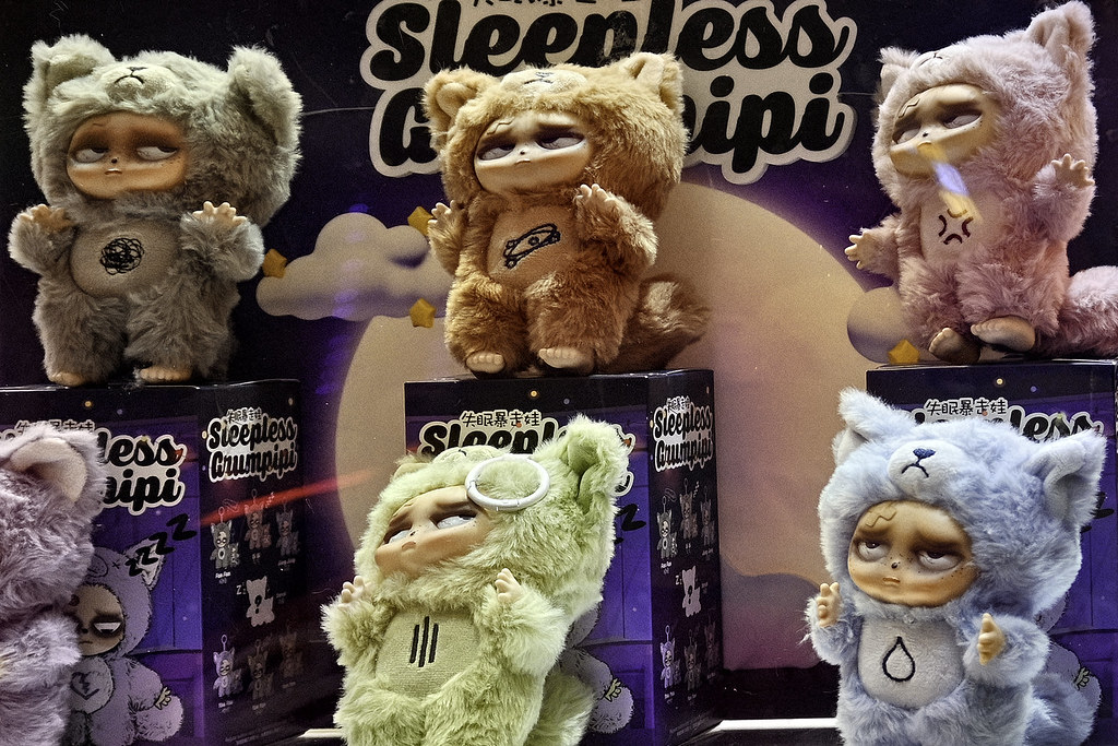 Colorful Plush Bear-Costumed Collectibles on Display at Westgate Mall Toy Store