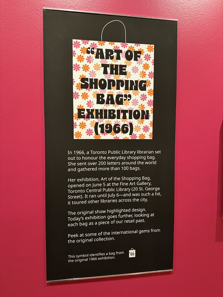 Art of the Shopping Bag Exhibition (1966) – Toronto Central Public Library signage on a magenta gallery wall