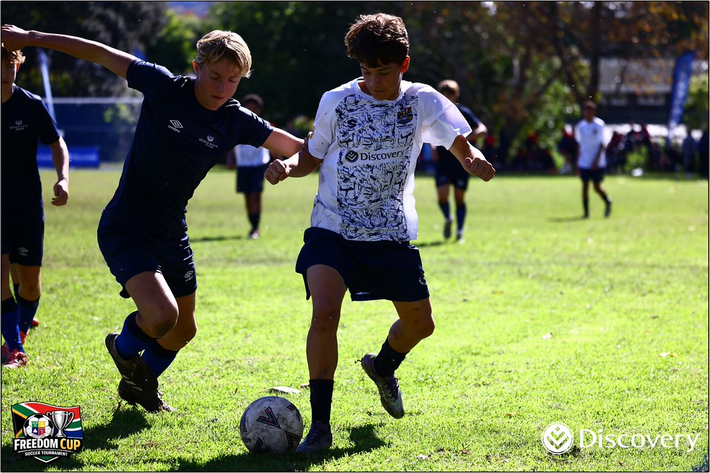 WBHS Freedom Cup U15: Bridge House vs Wynberg — Sunlit field clash during a youth soccer tournament