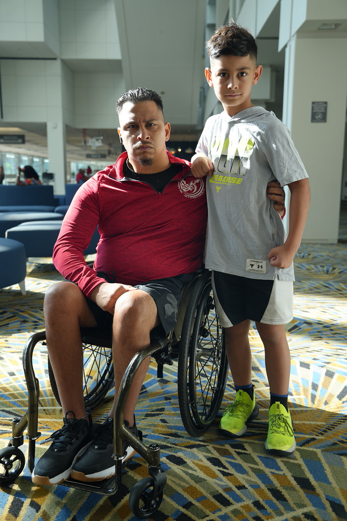 NVWG 2026: Portrait of a wheelchair athlete with a young companion at a Detroit venue (July 9-14, 2026)