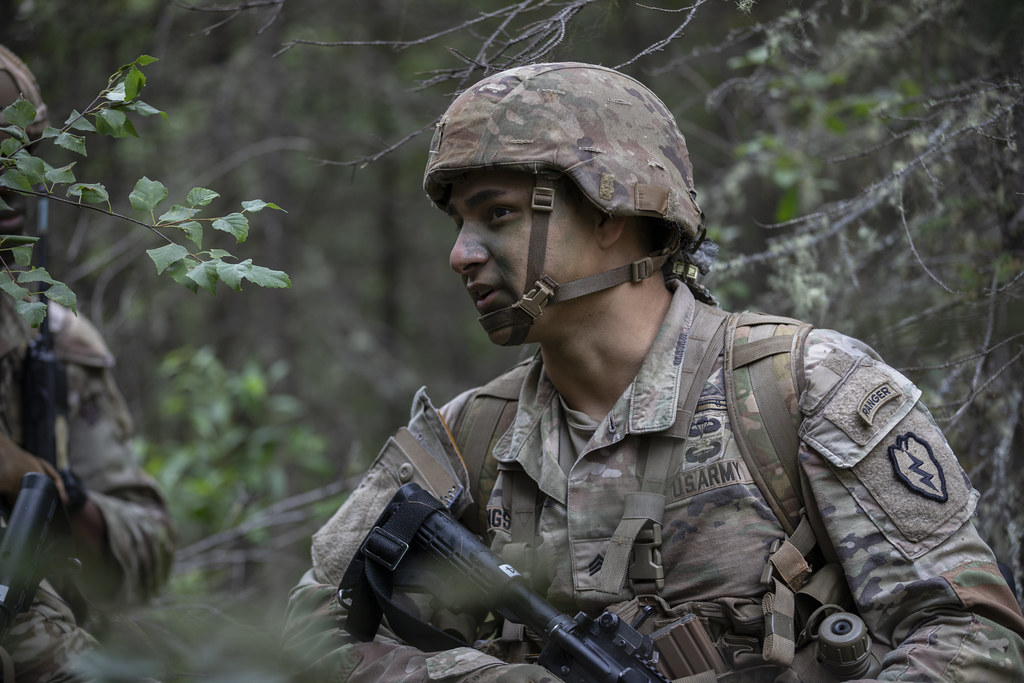Alaska Army National Guard infantryman in woodland training during Infantry Advanced Leader Course