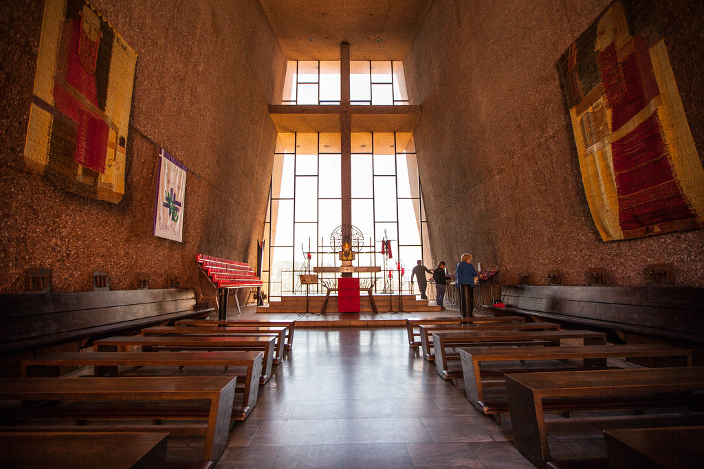 Light-Flooded Modern Nave: Concrete Walls, Tall Clerestory Windows, and a Minimalist Altar