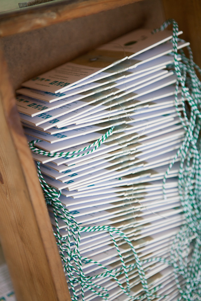Bound Booklets in a Wooden Crate, Secured with Green-and-White Rope