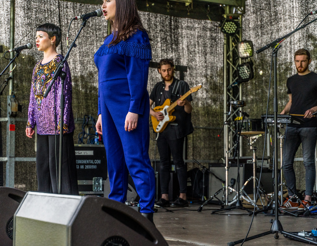 Africa Day flagship stage, Farmleigh, Dublin: Frontline vocalists in royal blue fringe dress and purple sequin top front a live band