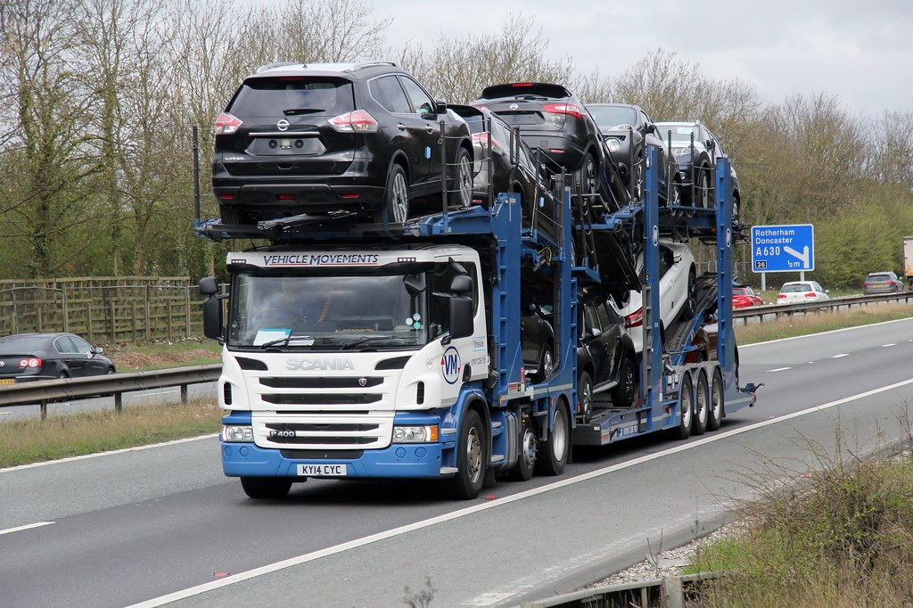 Vehicle Movements: Blue car carrier on a UK motorway with stacked vehicles