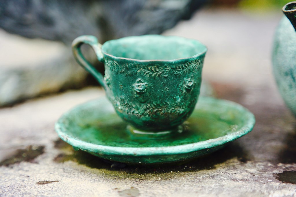 Emerald Cup of Tea in Hamilton Civic Gardens — Close-Up of a Textured Ceramic Teacup