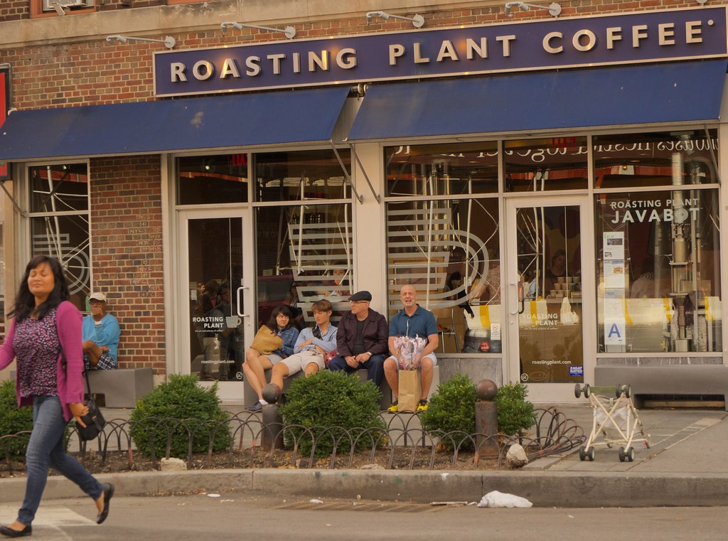 Greenwich Village curbside coffee moment outside Roasting Plant Coffee, 7th Ave & 11th St, NYC