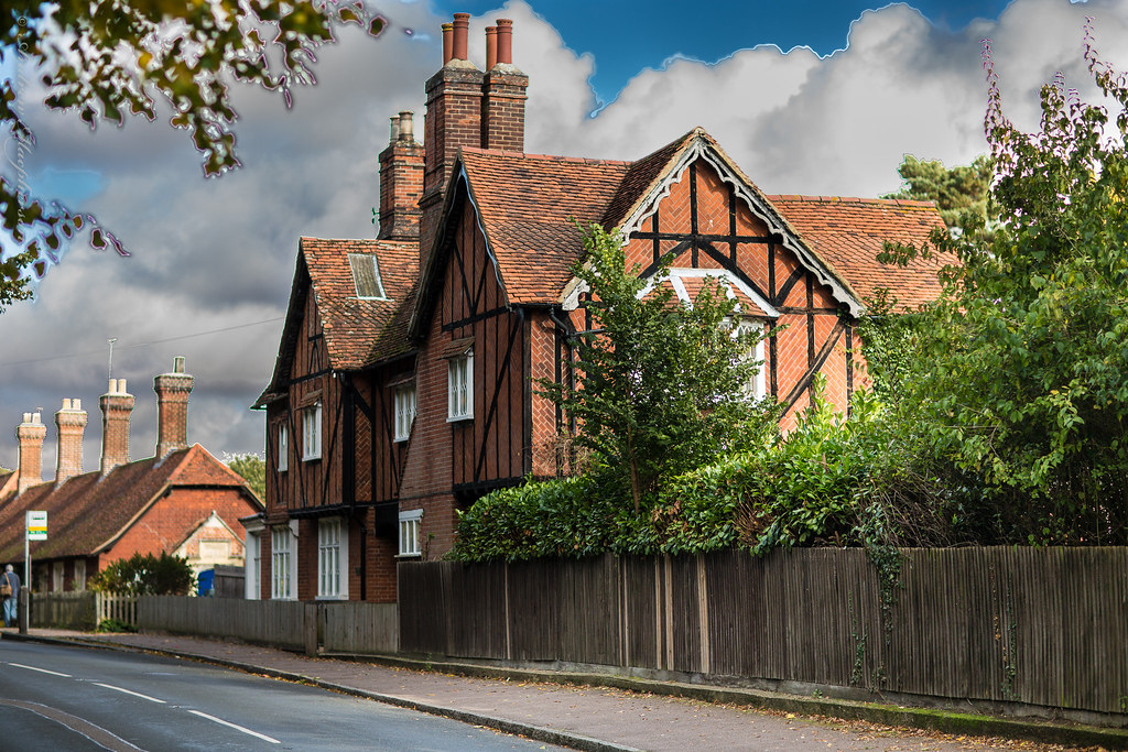 Historic Barn School: A Charming Tudor Revival in Autumn Light