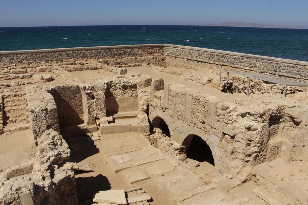 Coastal archaeological excavation in Heraklion, Crete — stone arches by the Aegean Sea