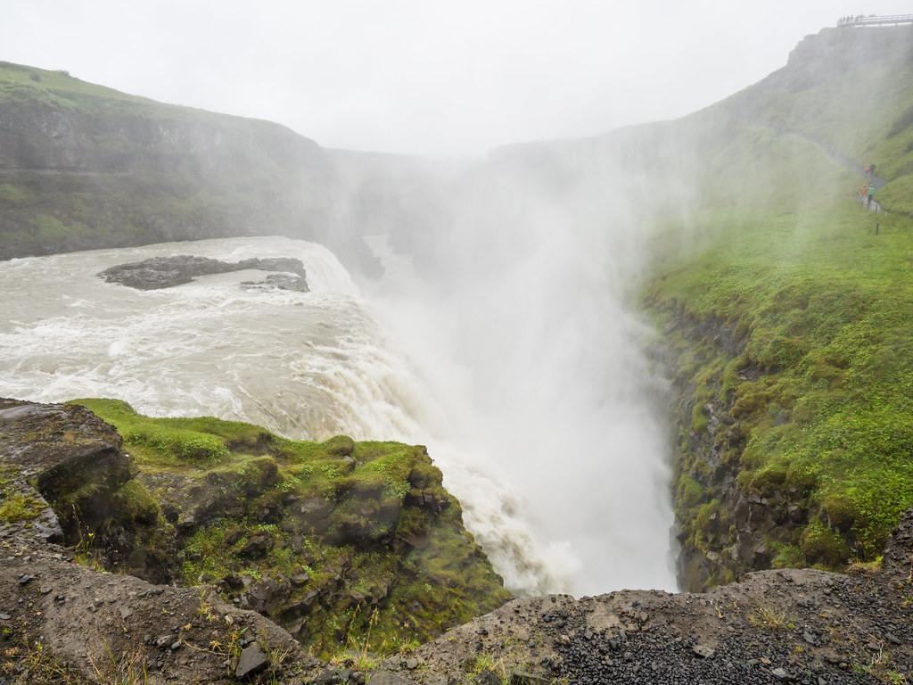 Gullfoss from the Rim: mossy cliffs and misty canyon in Iceland
