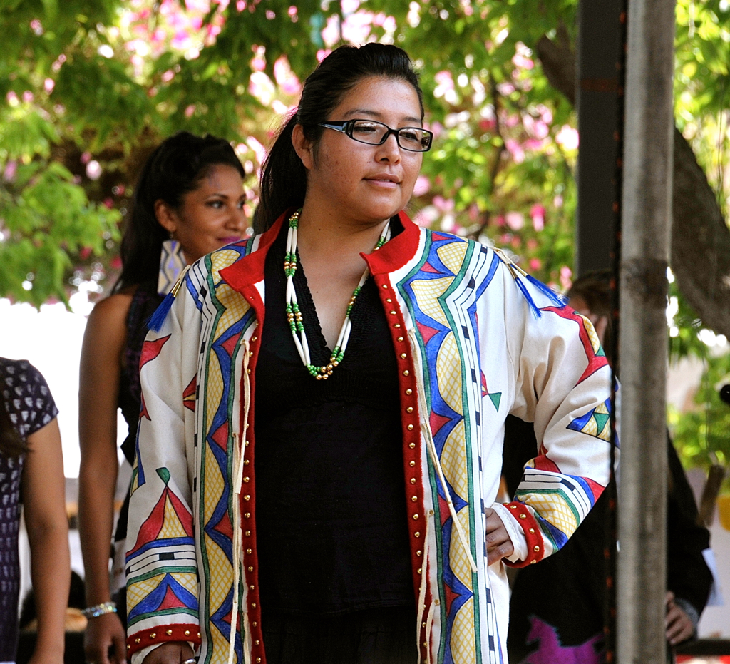 Portrait at Santa Fe Indian Market: participant in a bold geometric jacket and beaded necklace, 2012