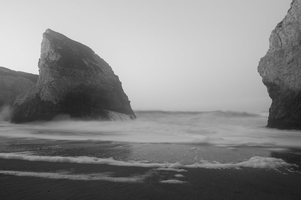 Rushed Away: Monochrome Seascape with Twin Sea Stacks and Silky Surf