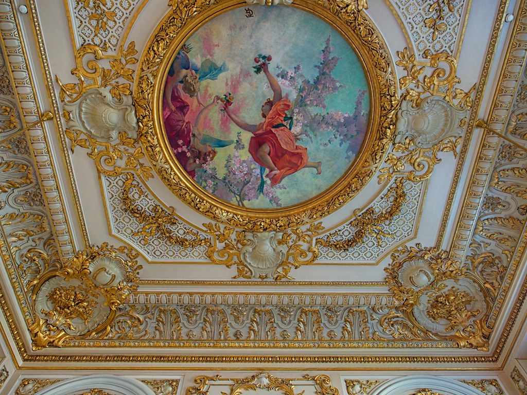 Gilded Circular Fresco at the Heart of a Parisian Rococo Ceiling, Surrounded by Ornate Gold Foliage